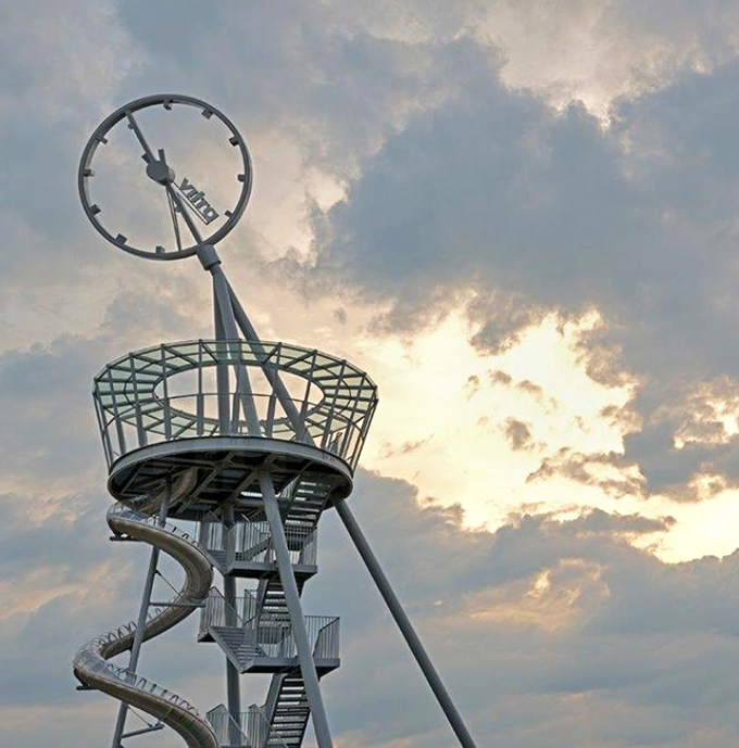 From the observation deck, visitors enjoy panoramic views of Aventura before surrendering to gravity's irresistible pull down polished steel slides.