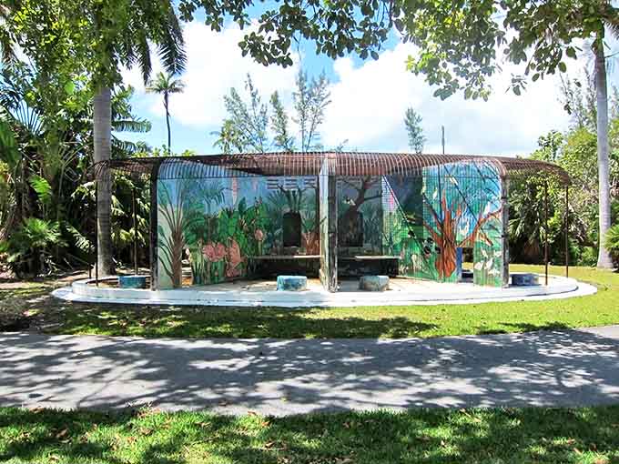 Vibrant murals and repurposed zoo structures create a surreal playground where exotic animals once lived.