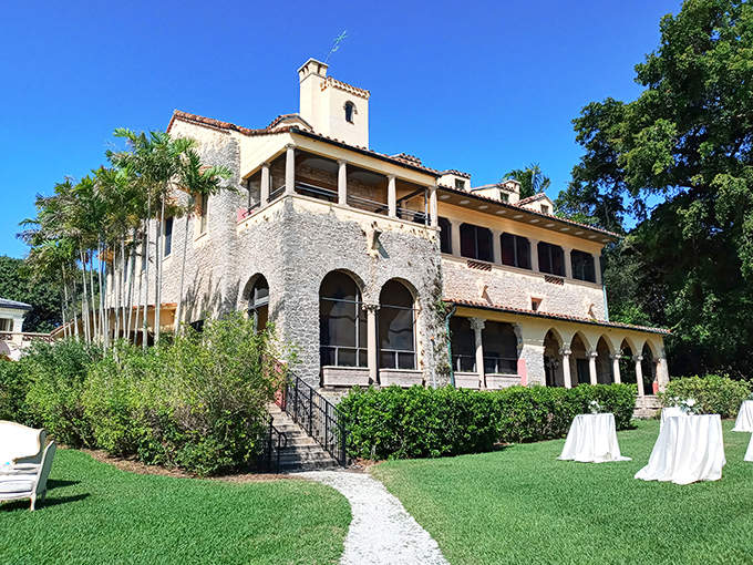 Deering Estate's stone mansion offers a glimpse of old Florida elegance, with arched walkways overlooking manicured lawns.