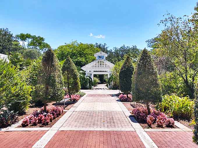 White columns and brick paths create a formal garden that would make any wedding photographer weep with joy.