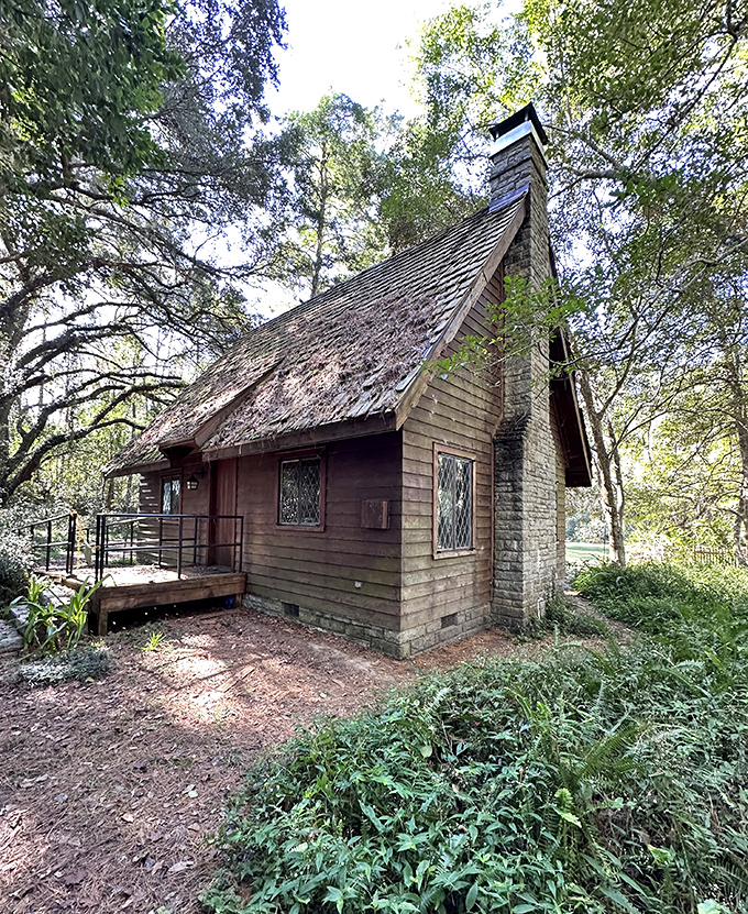 Fairy tales come to life at Lichgate Cottage, where this storybook A-frame nestles among ancient oaks like a forgotten chapter from the Brothers Grimm.