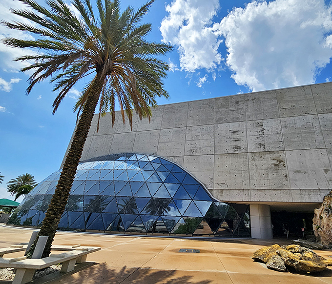 The Dali Museum's modern glass bubble contrasts dramatically with its concrete structure, reflecting the surrealist spirit of its namesake artist.