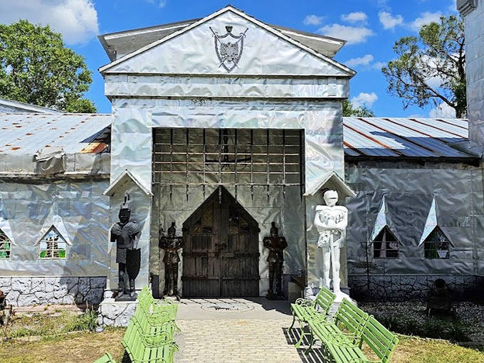 The entrance to this quirky attraction features whimsical knight statues guarding the door, hinting at the creative treasures waiting inside.