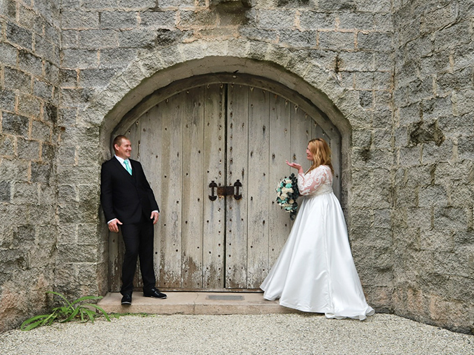 Love finds a way, even when that way involves massive wooden doors that require medieval-level upper body strength to open.