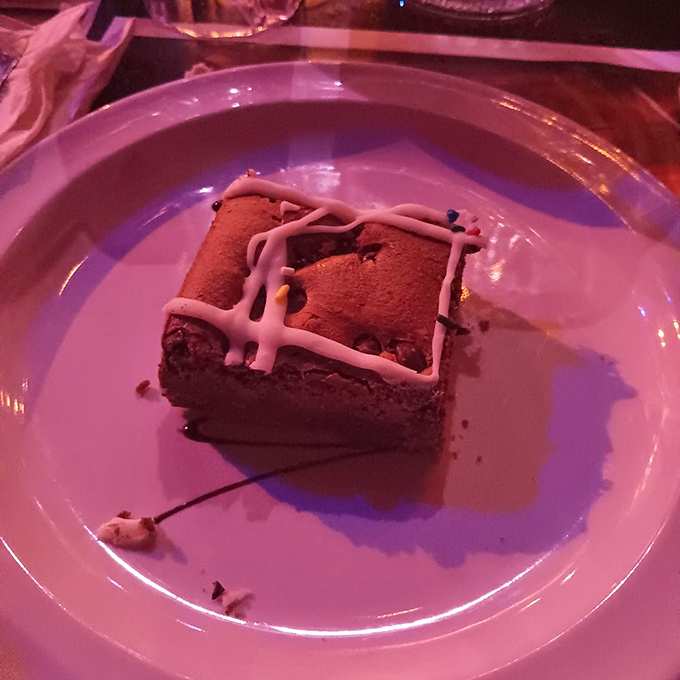 The Caribbean Moonshine Cake arrives like a sweet treasure chest, its rum-infused layers promising a delicious end to your pirate feast.