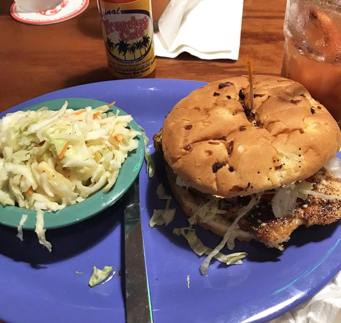 Cajun spices dance across this perfectly blackened grouper, nestled on a pillowy bun with crisp slaw providing the perfect counterpoint.