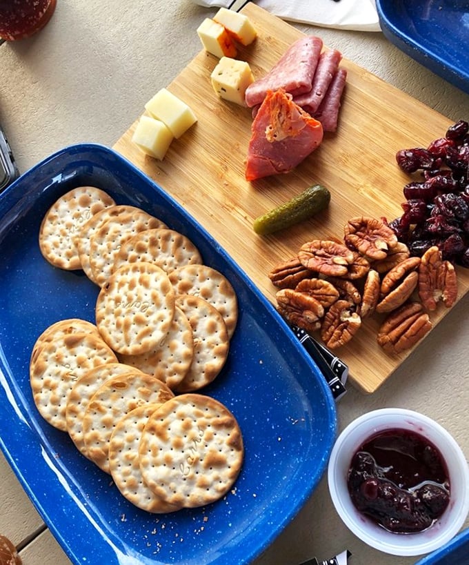 A cheese and charcuterie board that turns strangers into friends&mdash;nothing builds community faster than shared pecans and aged cheddar.