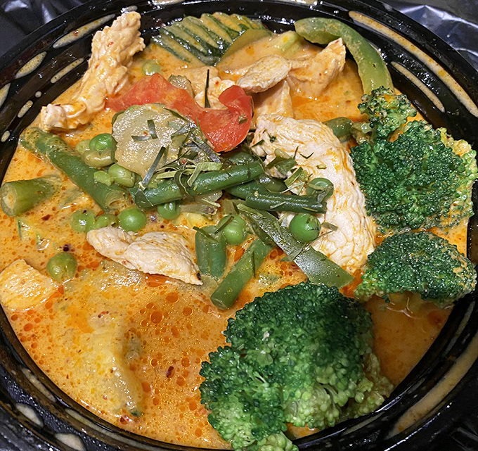 Steam rises from this aromatic masterpiece, where coconut creaminess meets perfectly balanced spices in harmonious union.