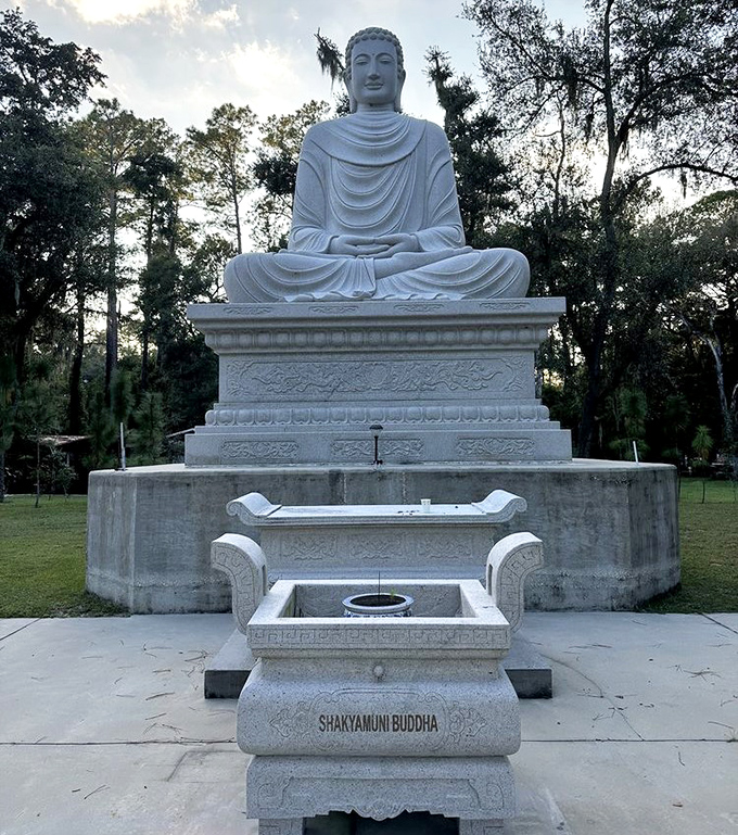 The Shakyamuni Buddha's serene expression seems to radiate peace across the entire temple grounds, drawing visitors into quiet contemplation.