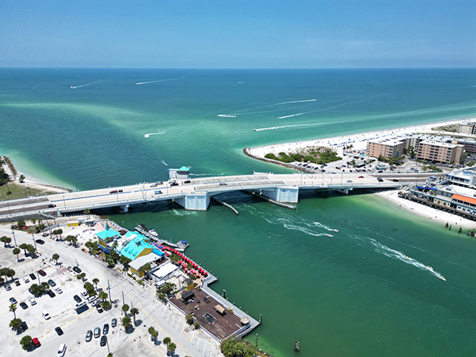 The iconic drawbridge connects island life to mainland convenience, with boats gliding beneath like clockwork.