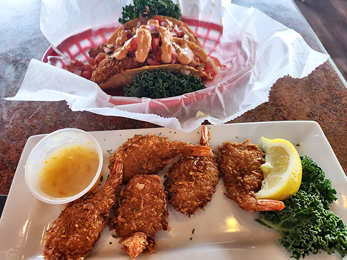 Double the deliciousness! Coconut shrimp and what appears to be a seafood taco &ndash; proof that paradise comes in many forms.
