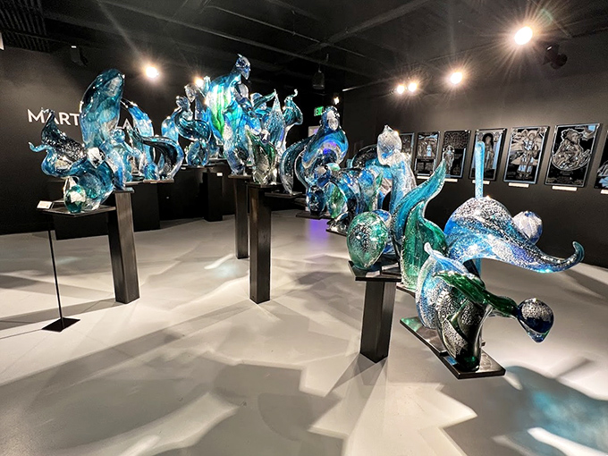 These vibrant blue sculptures seem to dance with light, like ocean waves frozen in mid-motion by some magical glass-wielding wizard.