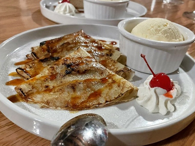 Crepes d'El Carajo arrive with a perfect caramelized exterior, dulce de leche, and a scoop of vanilla that melts into pure bliss.