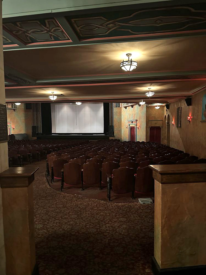 Empty seats waiting for showtime, each one holding decades of stories from first dates to family outings across generations.