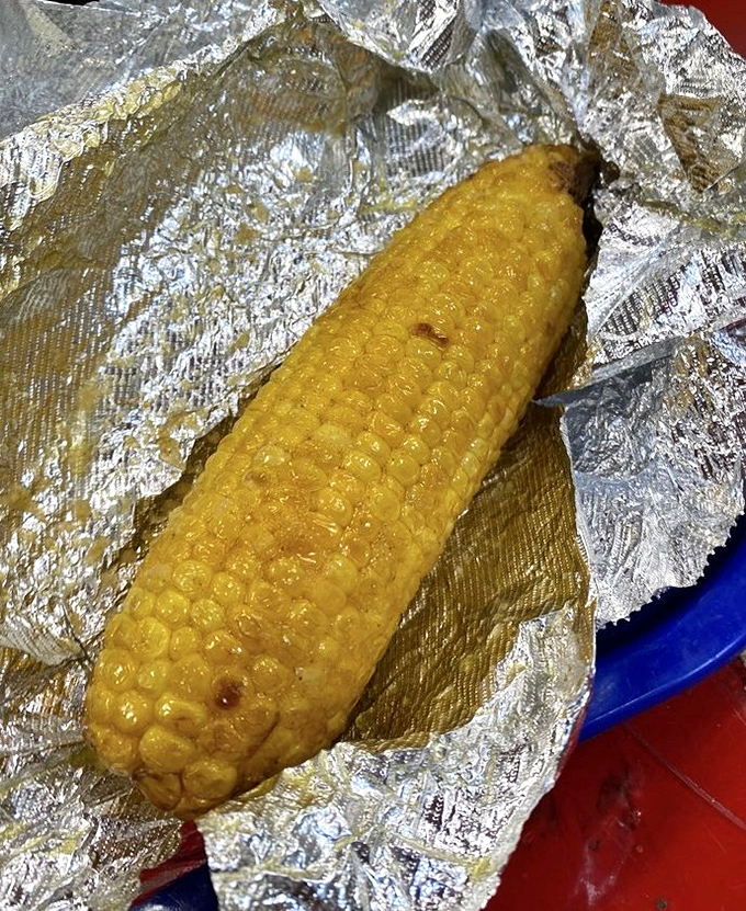 Golden perfection on a cob &ndash; their fried corn transforms sweet kernels into caramelized treasures, wrapped in foil and ready for butter.