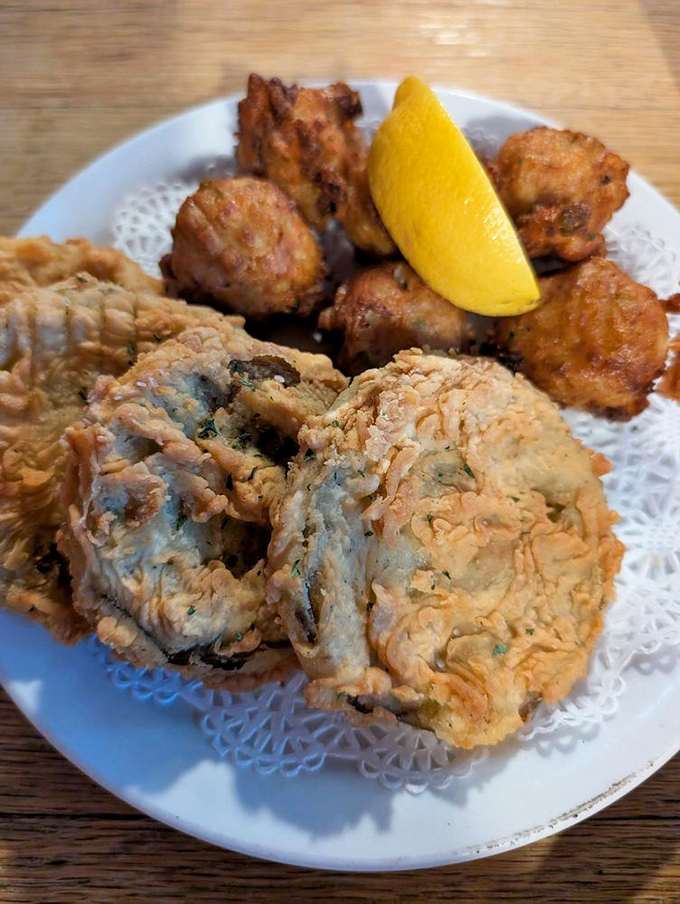 These aren't your average appetizers! Fried green tomatoes and fritters arrive on delicate doilies, bringing Southern charm to the table before the main event.