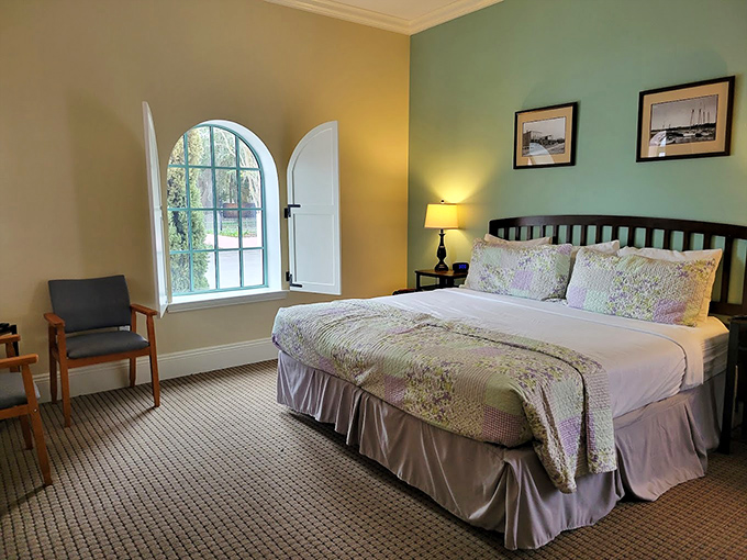 Guest Room Interior: Sunlight streams through arched windows, casting golden patterns across a bed that invites afternoon naps and dreams of Roaring Twenties adventures.