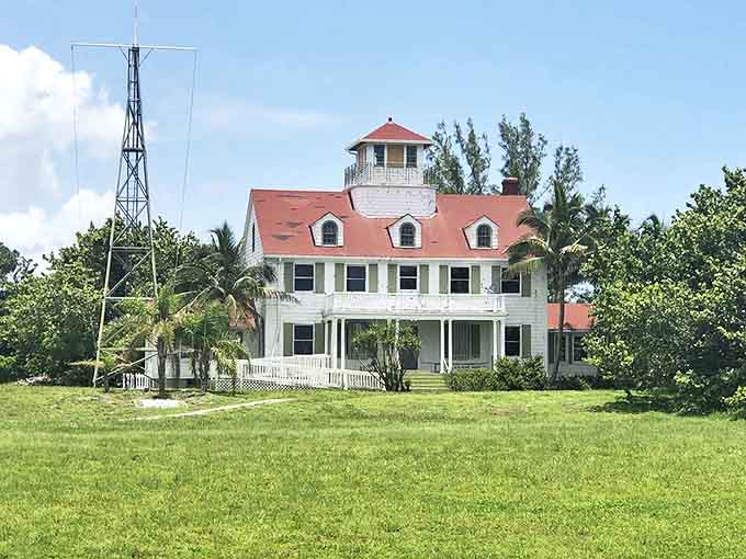 History stands tall at the vintage Coast Guard Station, its white facade and red roof telling stories of maritime adventures from decades past.