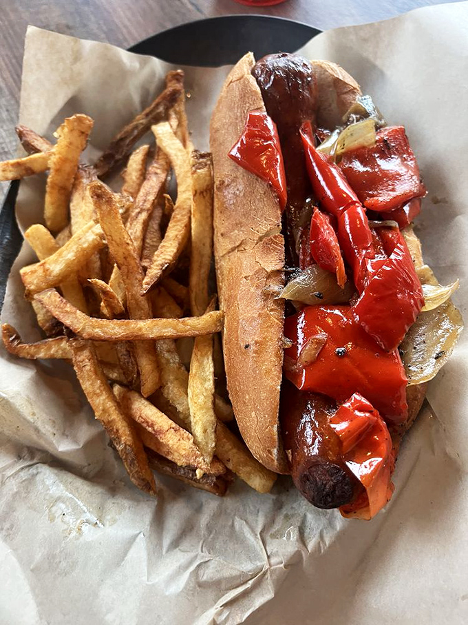Served alongside hand-cut fries that crackle with each bite, this Italian sausage dog with its caramelized peppers is summer nostalgia on a bun.
