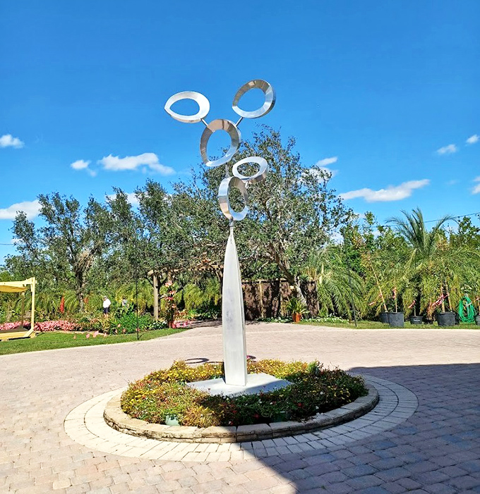 Catching Florida sunshine like a cosmic wind chime, this kinetic ring sculpture dances with every passing breeze.