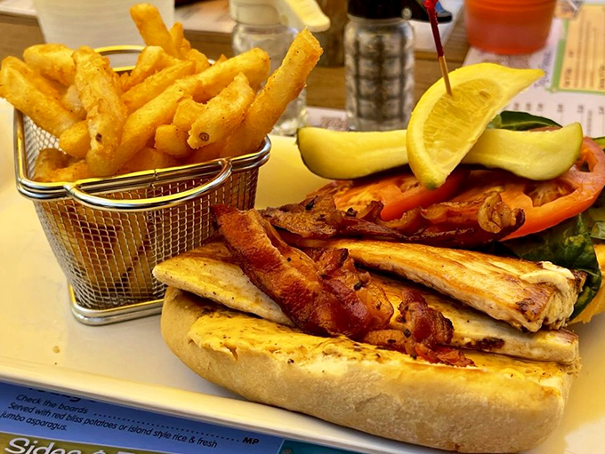 Golden fries nestled beside the Mahi Mahi BLT &ndash; a beach-perfect pairing that satisfies the soul as much as the stomach.
