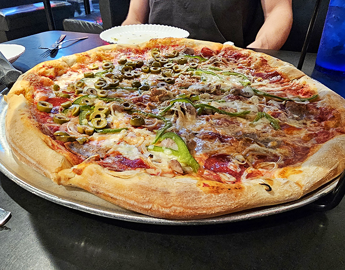 Loaded with fresh toppings, this mushroom and green pepper pizza demonstrates Sky's commitment to quality ingredients and perfect balance.