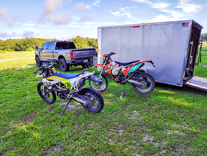 A rider in orange tackles the yellow beast &ndash; this quad has seen its share of mud battles and lived to tell the tale.