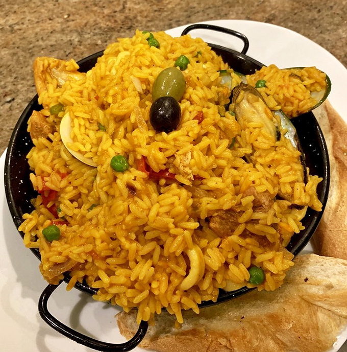 Saffron-kissed rice cradles seafood treasures and vegetables &ndash; each spoonful a different combination of flavors, like edible Spanish lottery.