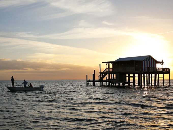 Golden hour transforms this stilt house into a silhouette against the setting sun &ndash; Florida magic at its finest.