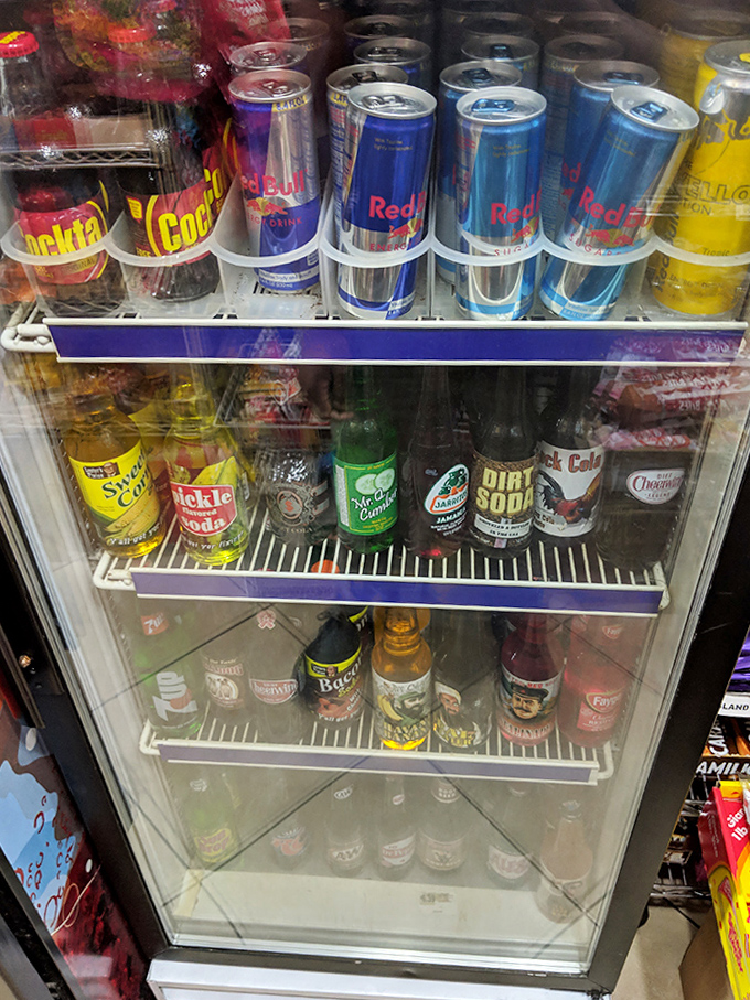 The beverage case houses liquid nostalgia – from regional sodas to bizarre flavor experiments that dare you to expand your refreshment horizons.