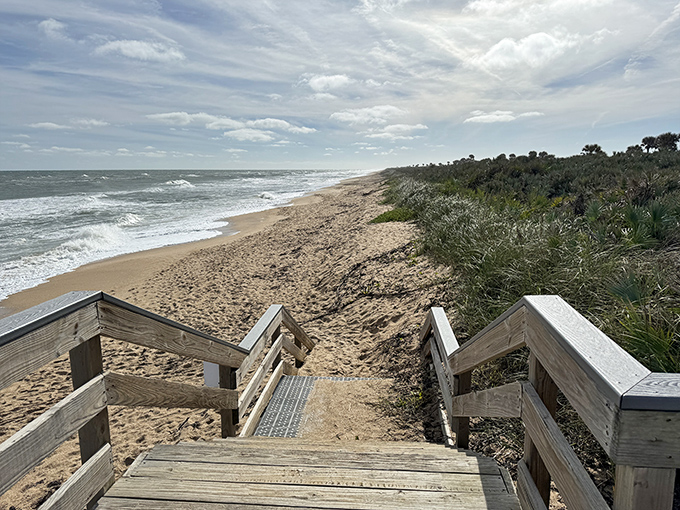 Sandy shores stretch toward the horizon like nature's welcome mat, inviting barefoot wanderers to leave temporary signatures in the golden grains.