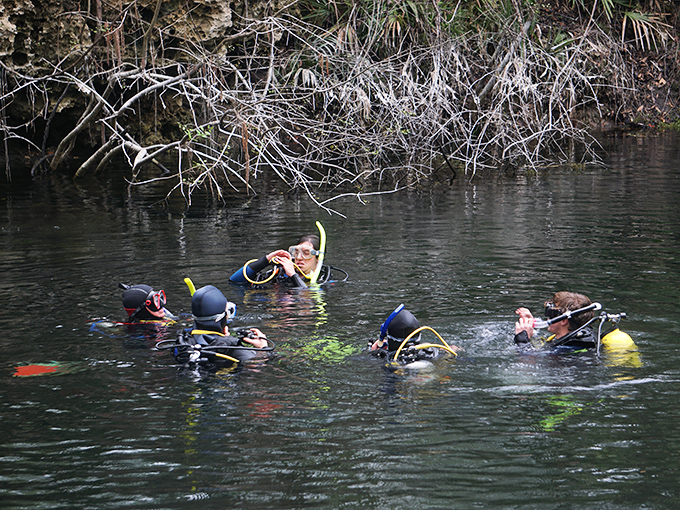 Cave diving's ultimate buddy system in action – these underwater explorers rely on teamwork while venturing where sunlight fears to tread.