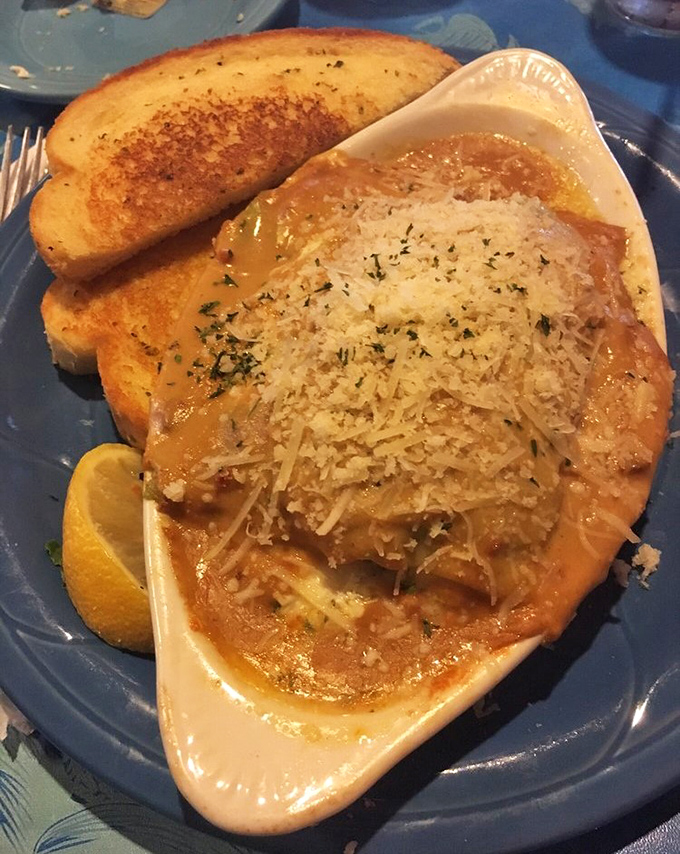 Comfort in a casserole: The seafood lasagna arrives steaming hot with garlic toast ready to soak up every last drop of that heavenly sauce.