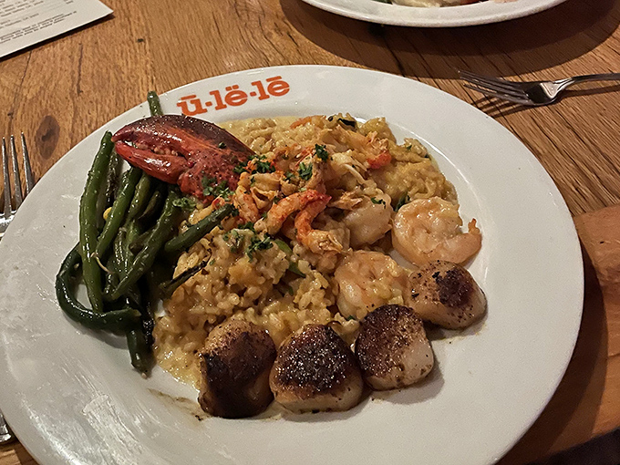 The Seafood Risotto arrives like a treasure chest from the Gulf &ndash; plump shrimp, tender scallops, and fresh fish nestled in creamy saffron-infused rice.