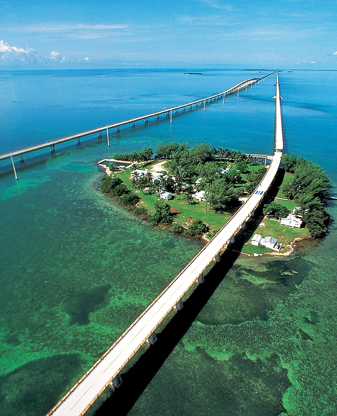 The iconic Seven Mile Bridge stretches across impossibly blue waters, offering drivers and pedestrians alike a journey that feels like floating above the ocean.
