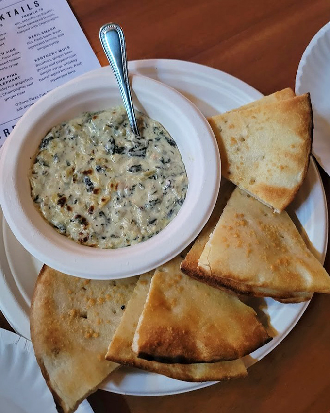 Creamy, garlicky heaven awaits in this spinach artichoke dip &ndash; comfort food that soothes both the living and possibly the dead.