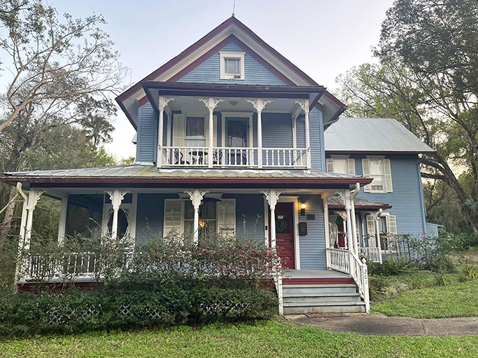 The Ann Stevens House from 1895 showcases Victorian charm with its blue exterior and wraparound porch that practically whispers "come sit a spell."