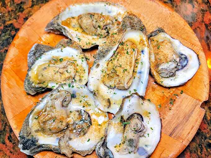 Fresh oysters glistening with garlic butter prove that sometimes simple preparations are the most spectacular.