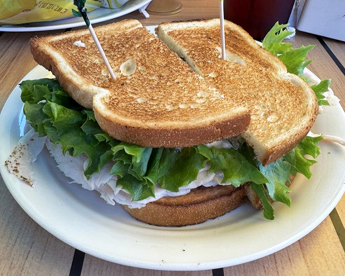 The perfect turkey sandwich isn't just about the bird &ndash; it's about that golden toast and the mountain of fresh greens.