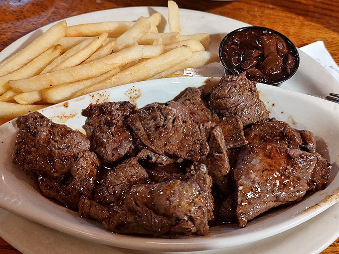 A hearty plate of venison steak cubes with crispy fries makes for a satisfying meal that honors Florida's hunting traditions.