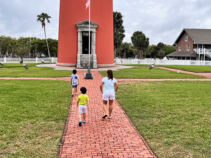 Families create lasting memories as they approach the towering structure, each step bringing them closer to Florida's maritime heritage.