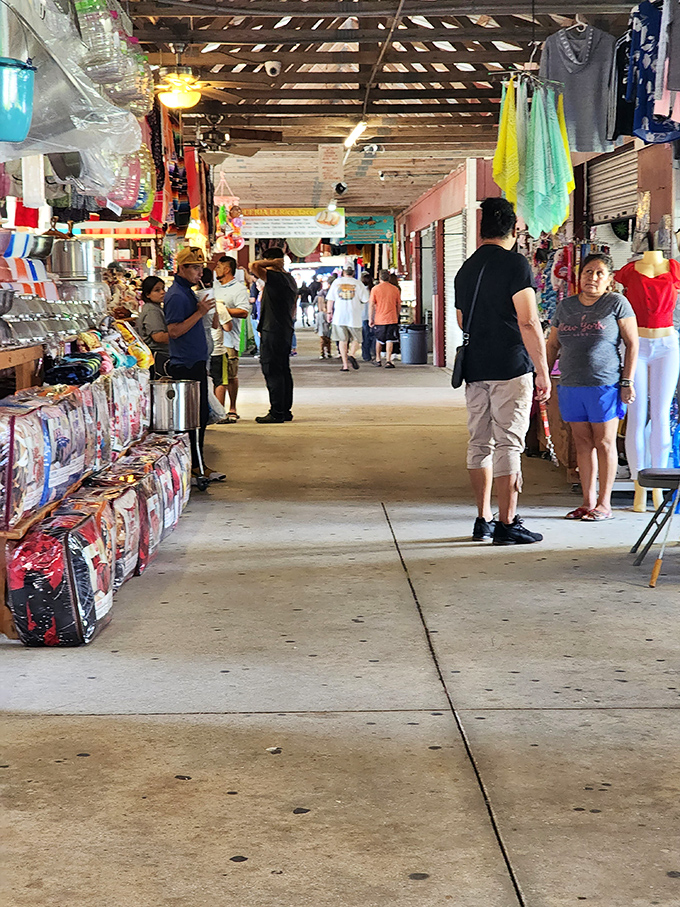 Shoppers navigate the market's labyrinth, where conversations flow as freely as the treasures change hands.