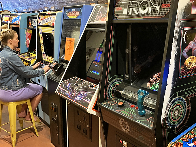 Concentration etched on her face, this player demonstrates the universal truth: no matter the decade, a good arcade game demands your full attention.