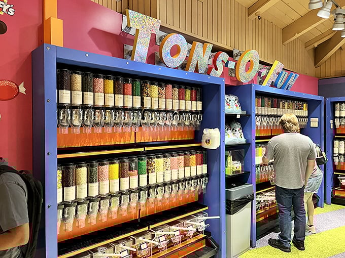 The "TONS-O-TREATS" wall features a rainbow of candies in dispensers, where self-control goes to die a happy death.