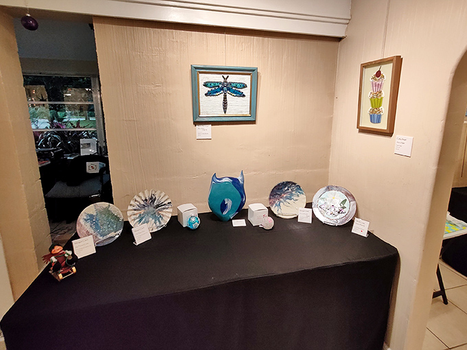 Delicate ceramic creations line the display table, each piece telling its own story through color, form, and the unique touch of its creator.