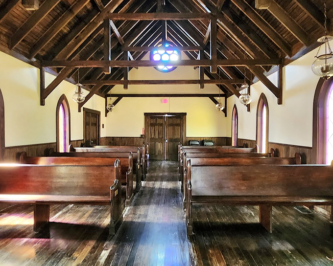 Sunlight streams through simple windows in this pioneer church, where communities gathered for both spiritual guidance and social connection.