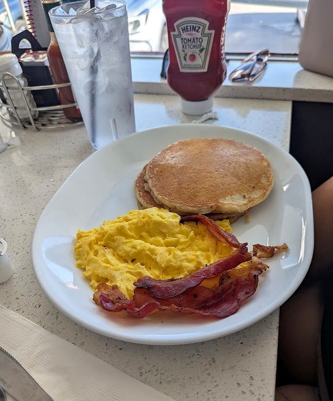 Golden pancakes paired with eggs and bacon create the breakfast trifecta that's been curing hangovers and starting days right since the diner opened its doors.