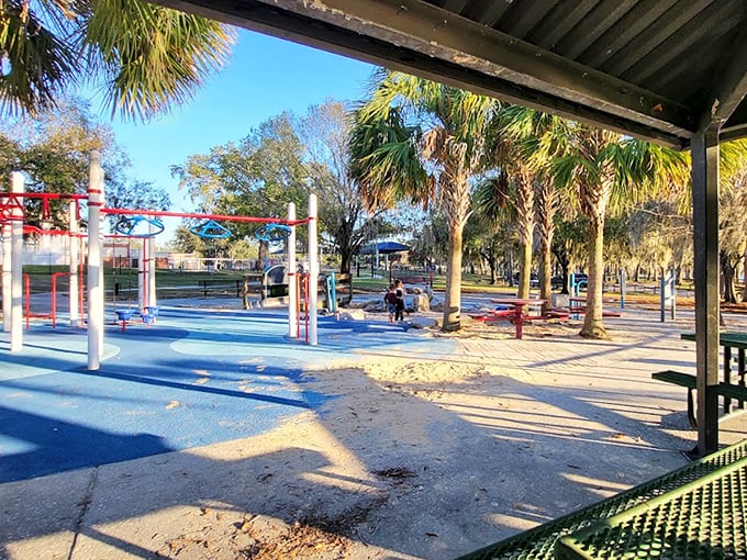 Colorful playground equipment stands ready for young adventurers, proving Riverhills Park caters to visitors of all ages and energy levels.