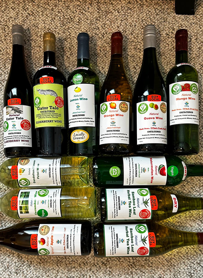 Bottles proudly displaying "Buy Local" stickers showcase Bunker Hill's commitment to Florida agriculture, from Gator Tale elderberry to bright lemon wine.