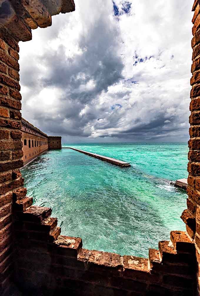 Framed by weathered brick, the view from Fort Jefferson's windows reveals water in shades of blue that no paint company could possibly replicate.